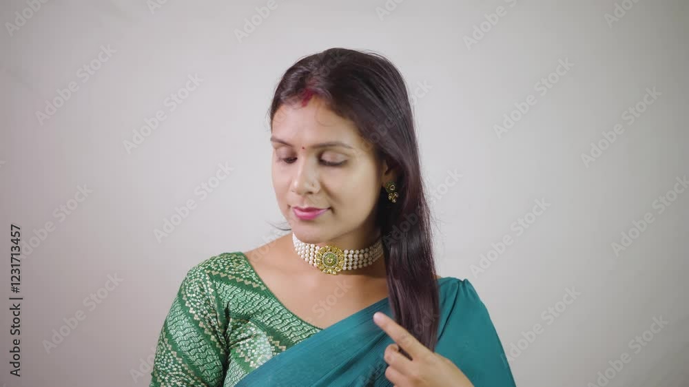 Indian woman adjusting hair, Traditional Indian woman styling hair ...