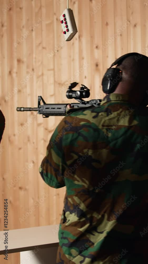 Vertical video Team of army soldiers practicing with firearms in ...