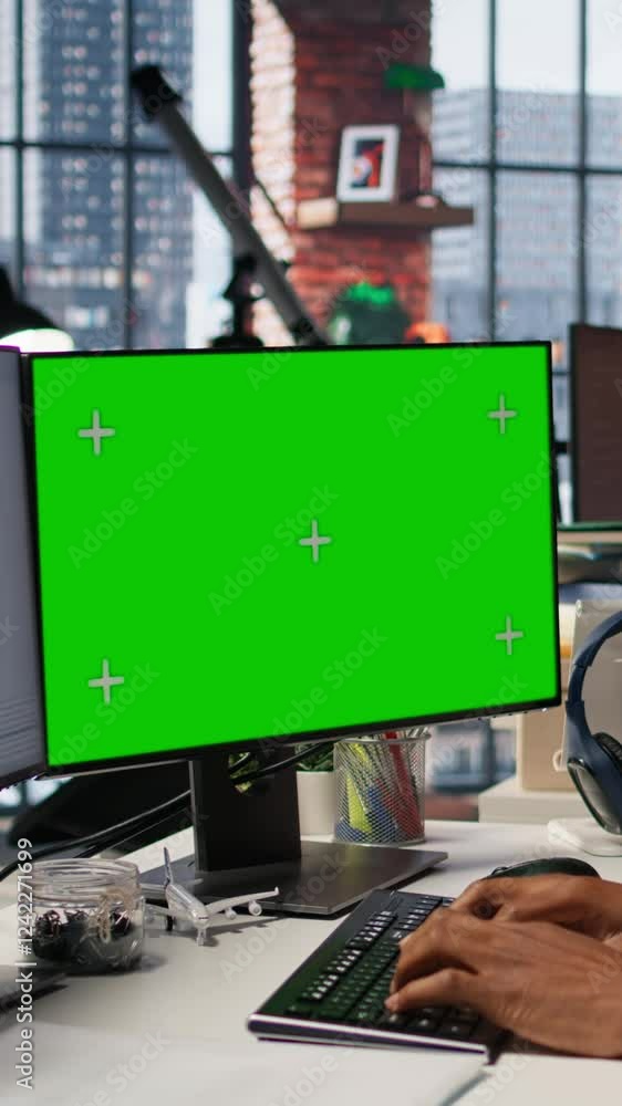 Vertical video Programmer coding in startup office using green screen PC, building scalable ...