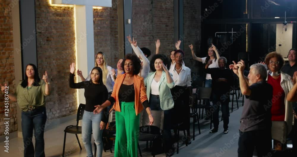 Congregation in worship, raising hands and engaging in prayer and ...