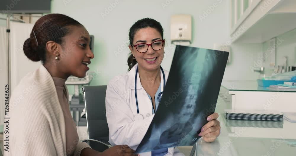Aged woman doctor radiologist holding x-ray, review magnetic resonance ...