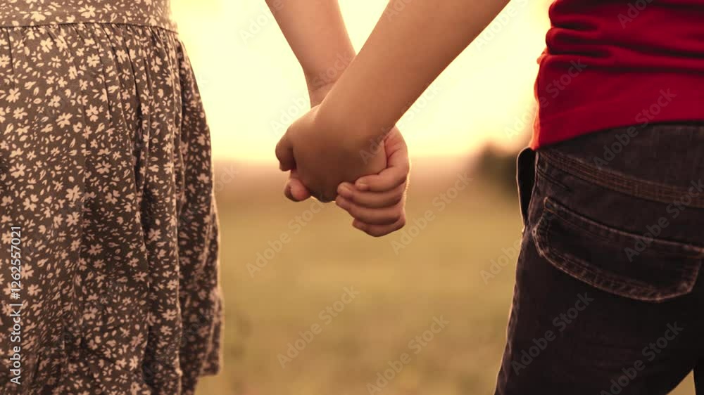 Children holding hands, baby girl boy at sunset, children playing in ...