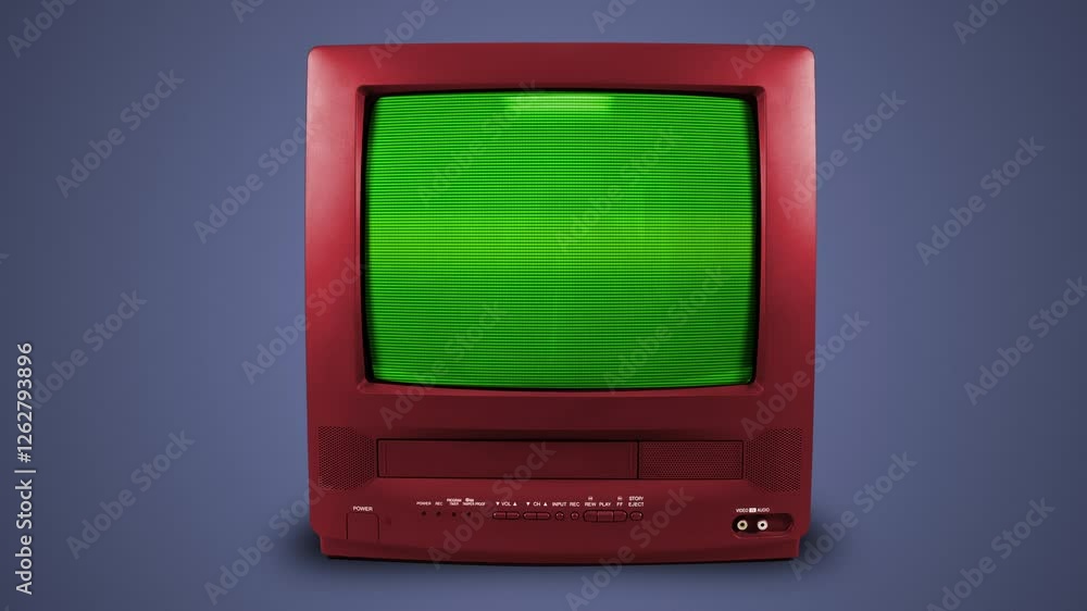 Old red TV on a violet background with a green screen. TV from the 90s ...