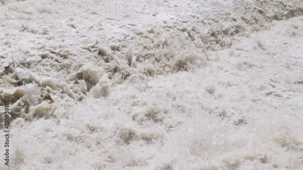 row of chute dentate blocks in concrete water spillway channel slope ...