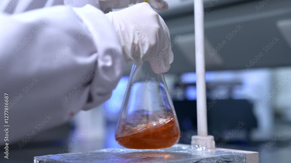 scientist in a lab mixing chemicals in a laboratory. chemist ...