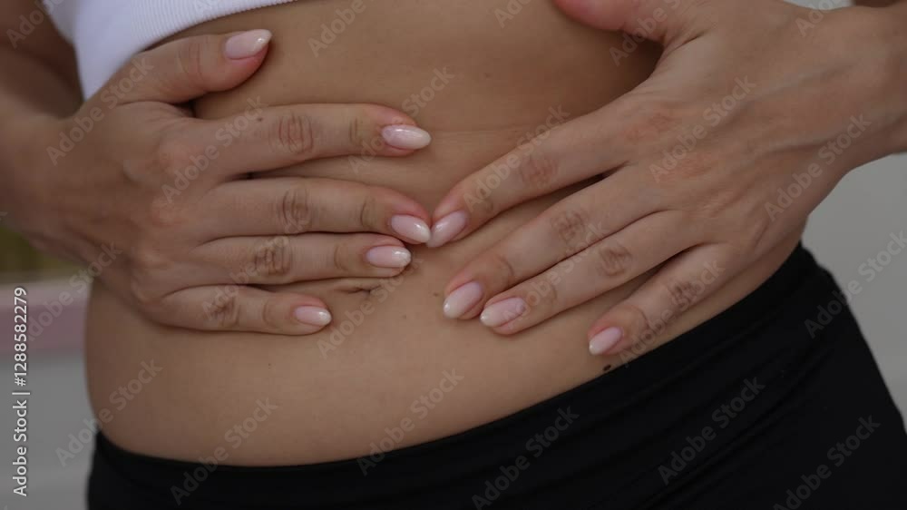 Young woman showing the appearance of white marks on the skin from ...
