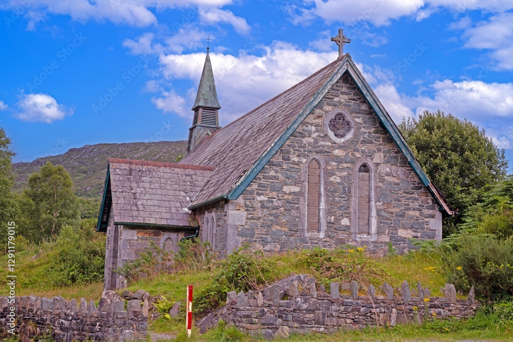 Poster Traditional stone church in the Irish countryside with blue sky ...