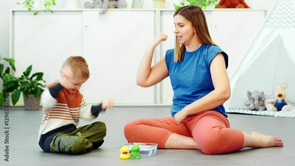 Baby Sign Language. Nonverbal child learning to sign with the help of a ...