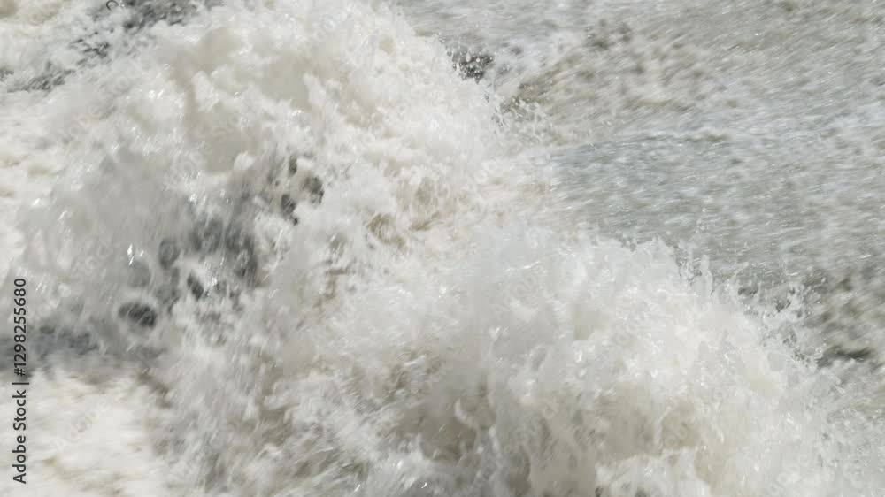 row of chute dentate blocks in concrete water spillway channel slope ...