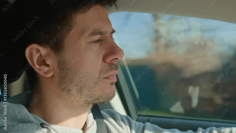 Man driving car, looking ahead with focus and concentration. Close up ...