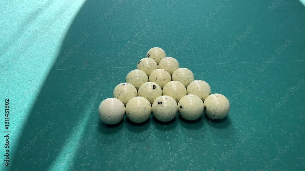 Pyramid of balls on the green field of Russian billiards, ivory balls ...