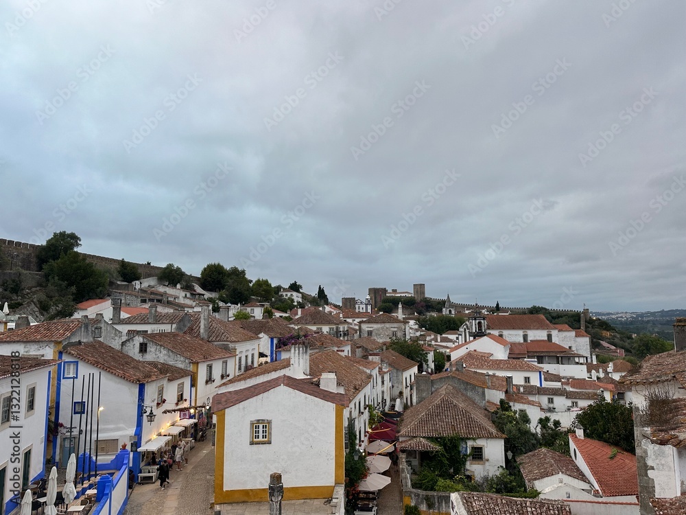 Poster Medieval townscape of Óbidos featuring its iconic castle, quaint ...