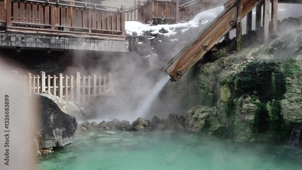 Hot spring water flowing out of a chute a main source of spring water ...