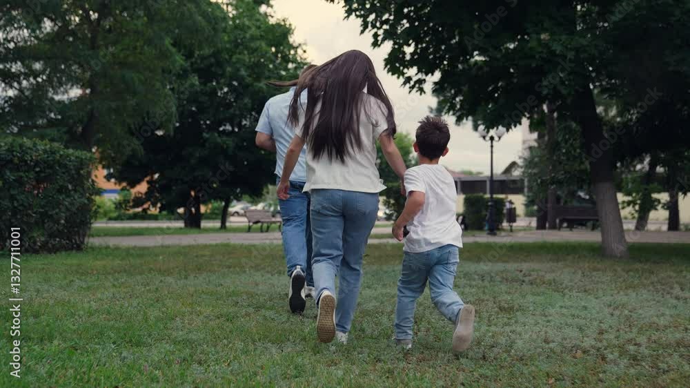 Parent child running park, three people, happy people playing run ...