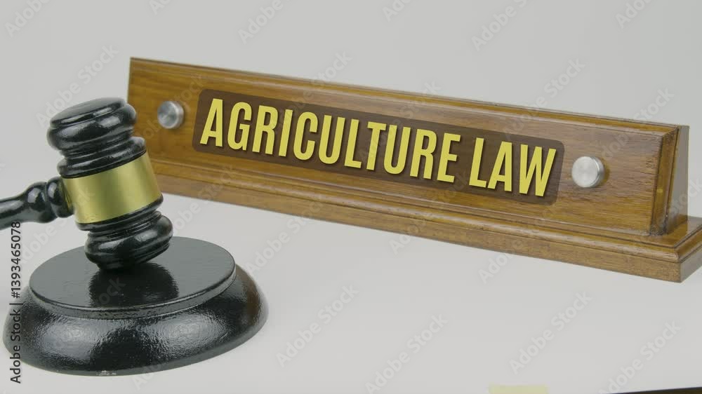 Vidéo Stock Agriculture Law word on a wooden nameplate with a gavel ...