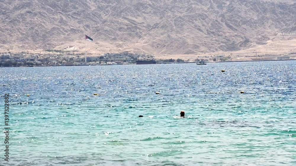 People are swimming opposite Aqaba city, Red Sea Stock Video | Adobe Stock