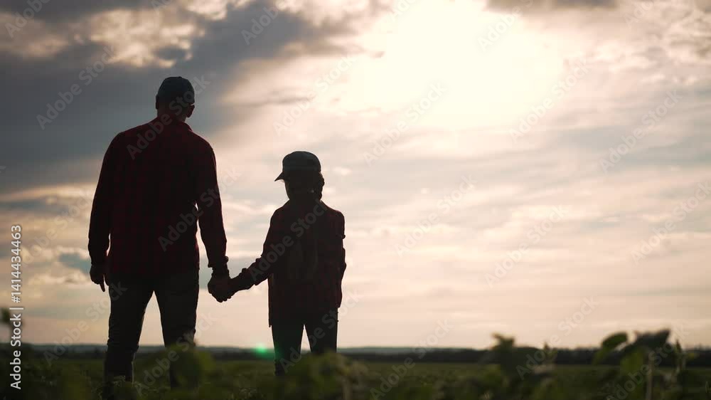 Family in crop field at sunset. Father and daughter bonding over ...