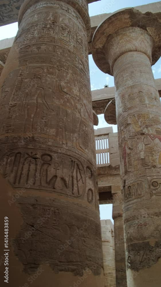 Open papyrus umbel capitals and architrave on the central columns of ...