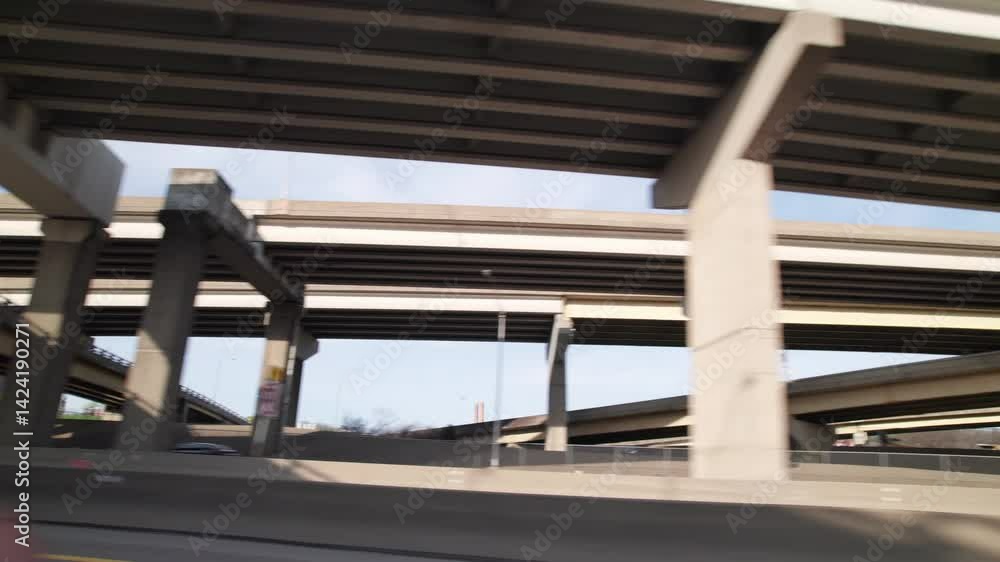 Vehicle driving point of view underneath highway and interstate ...