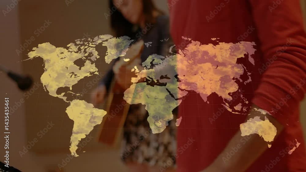 Musician duo presenting music, male speaking while female playing guitar with world map overlay ...