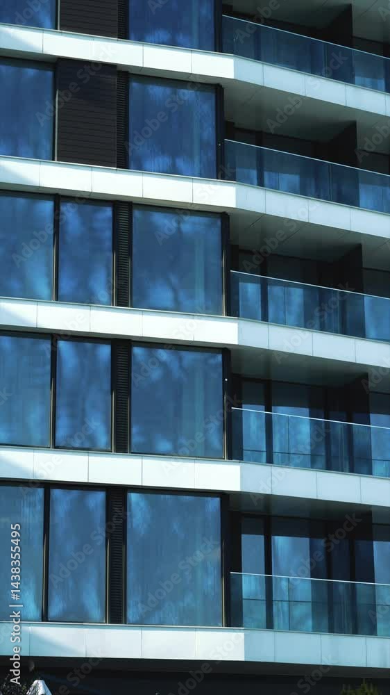 Large glass building. Modern architecture. Blue glass on the house ...