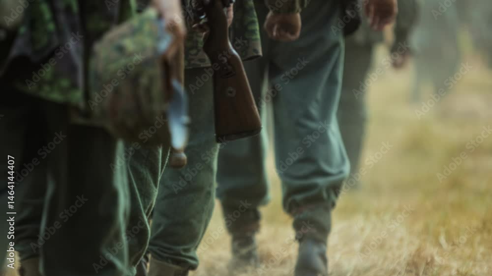 German soldiers wear camouflage pattern SS uniforms marching from ...