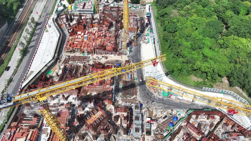 Aerial skyview of Tuen Mun subway extension project in Hong Kong, featuring elevated railway ...