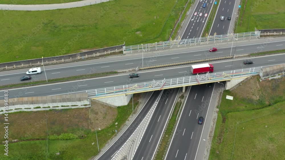 Angled aerial shot showing a modern highway overpass with vehicles ...