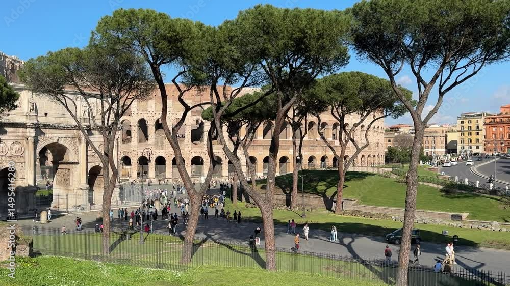 The Colosseum and Arch of Constantine stand side by side in Rome ...