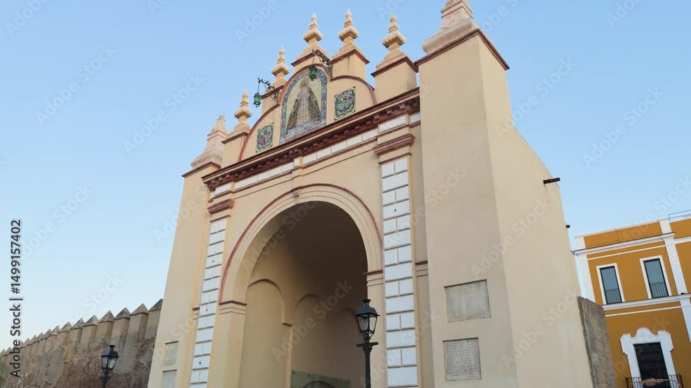 Frontal view of the historic yellow arch of La Macarena, with its ...