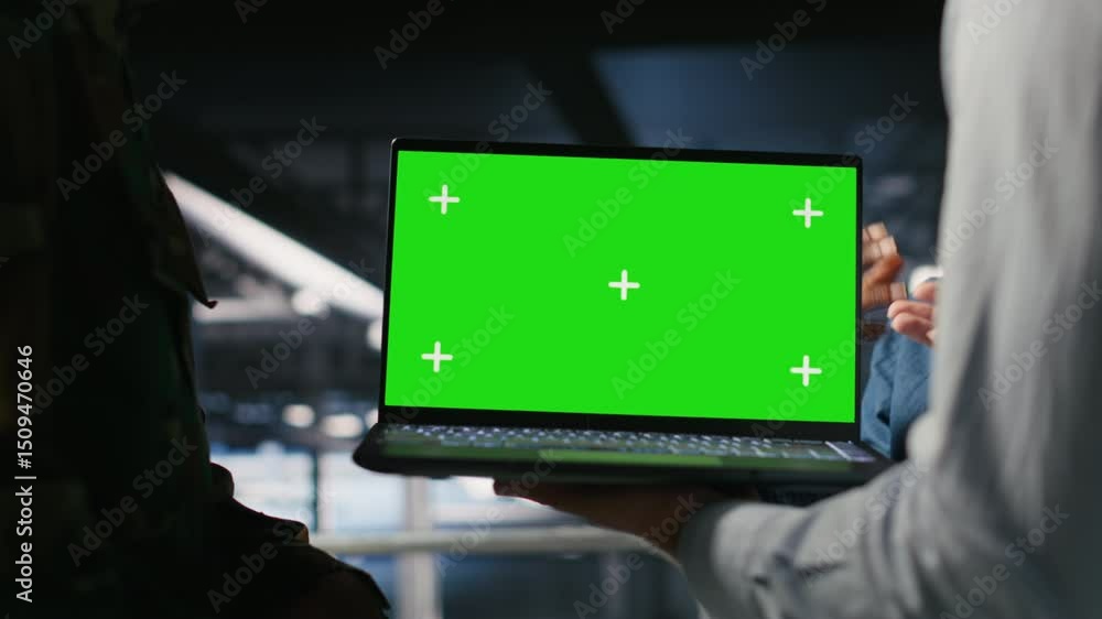Army engineering team in command center server hub using mockup laptop ...