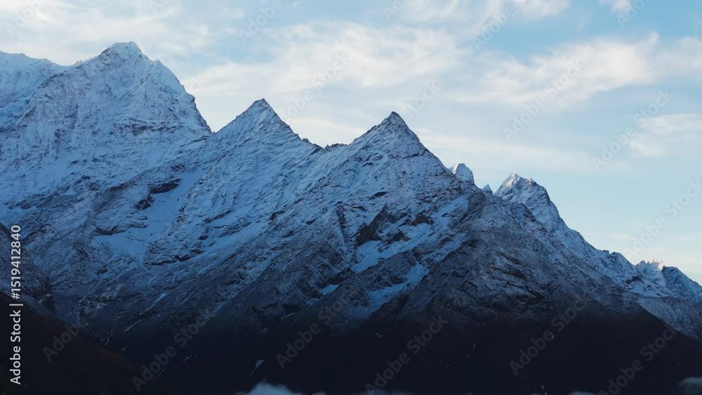 Towering Himalayan mountains frame the Everest Base Camp trekking route ...