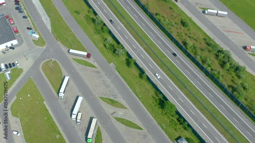 This overhead drone footage shows a four-lane motorway and adjacent ...