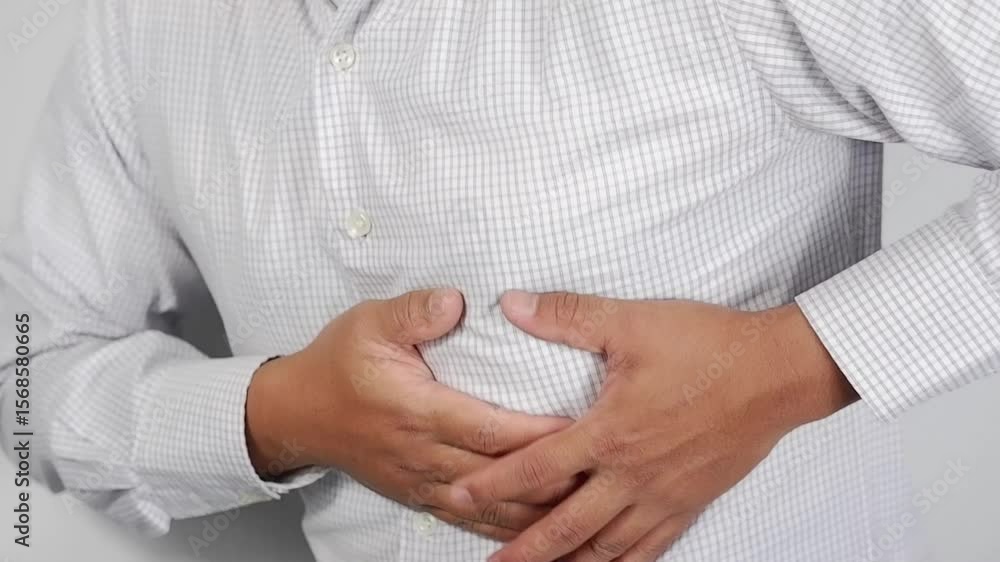 Sick Asian man experiencing abdominal pain, pain and discomfort, severe ...