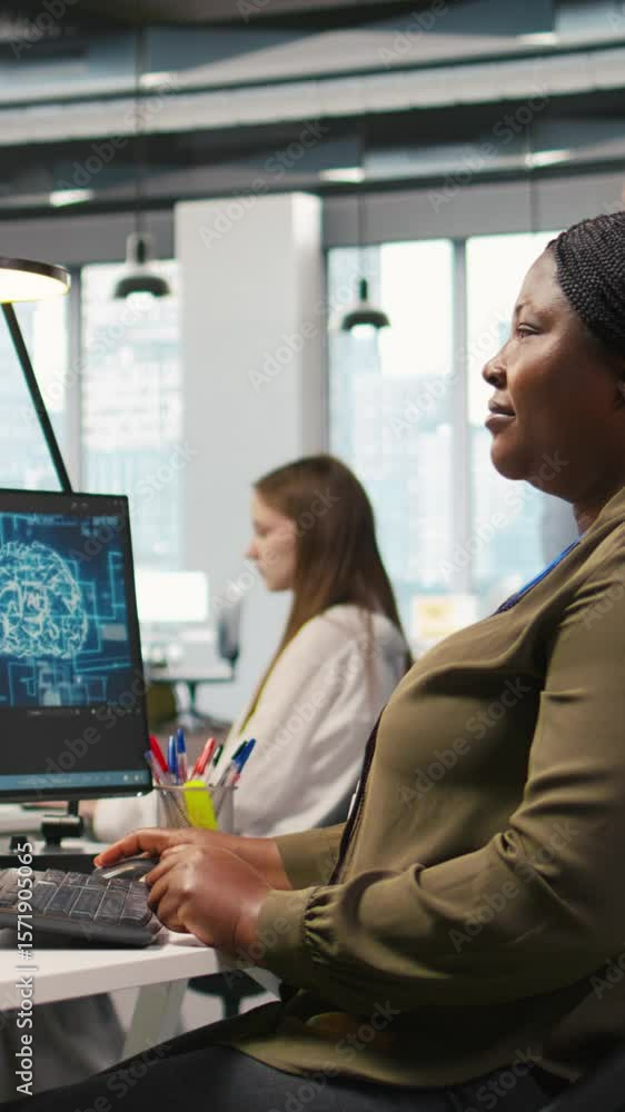 Vertical video Female technician writing code on PC, developing neural ...