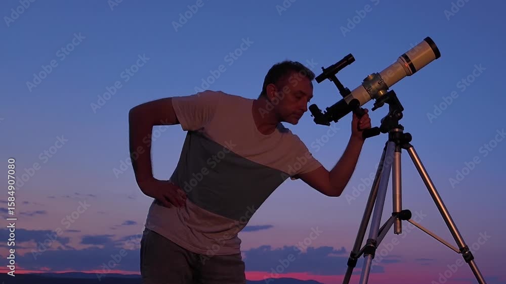 Amateur astronomer using telescope for watching stars, Moon, planets ...