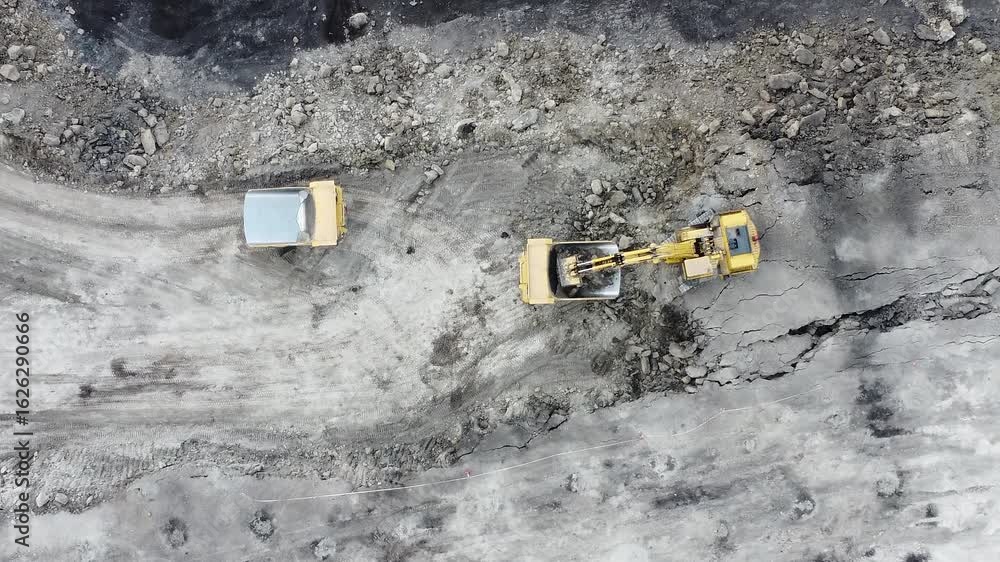 The process of dredging and loading soil into trucks to make hauling ...