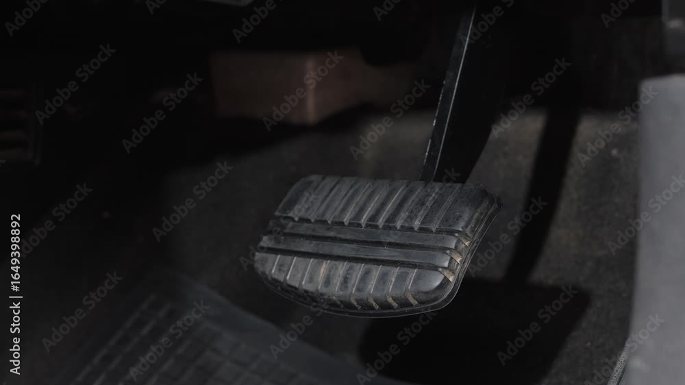The driver checks the car's brakes every time before a long journey for ...