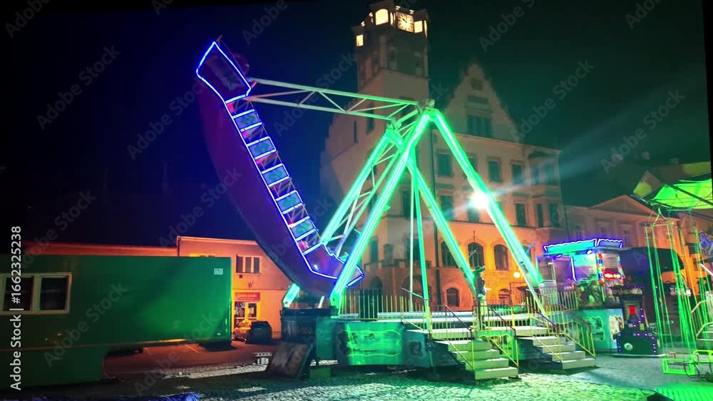 A popular attraction known as a pirate ship and a fairground merry go ...