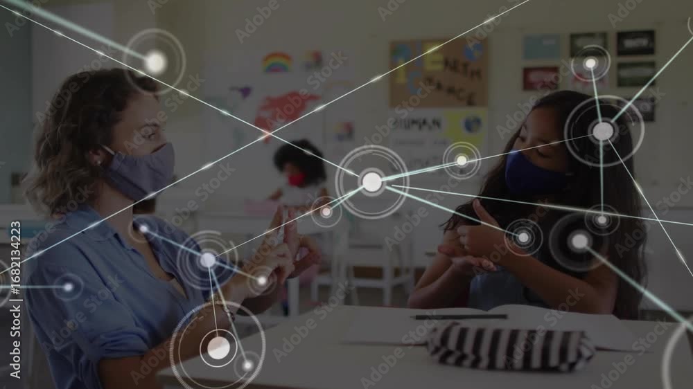 Teacher raising hands and student mimicking hand gestures in classroom ...