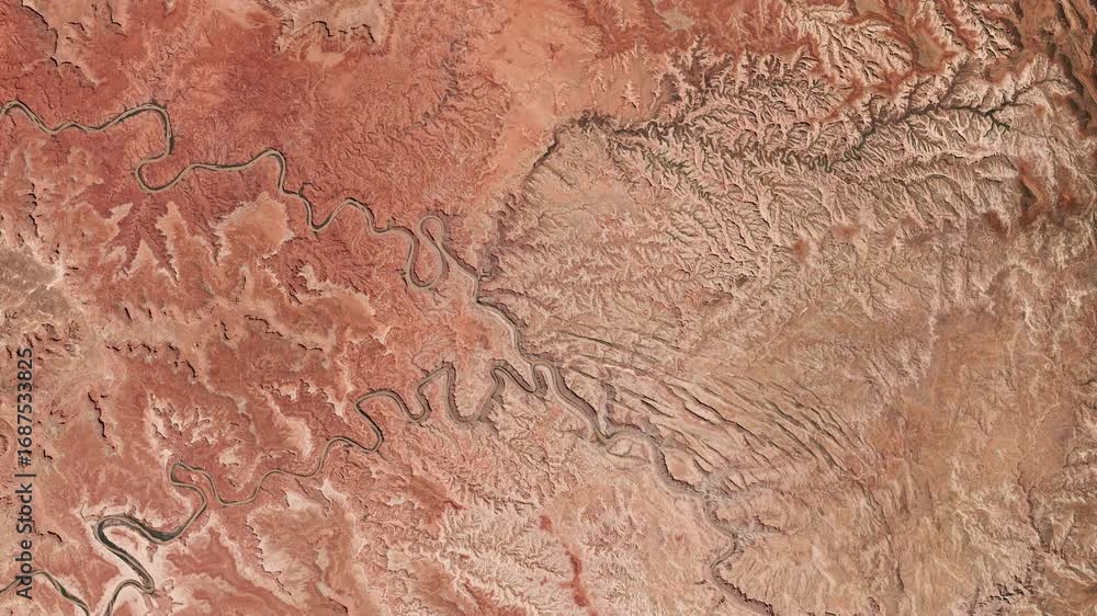 Bird's eye view on canyons and rivers among red rocks of desert. Camera ...