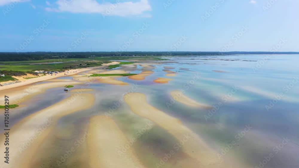 Scenic Cape Cod public beach captured by drone at ebb tide, where tidal ...