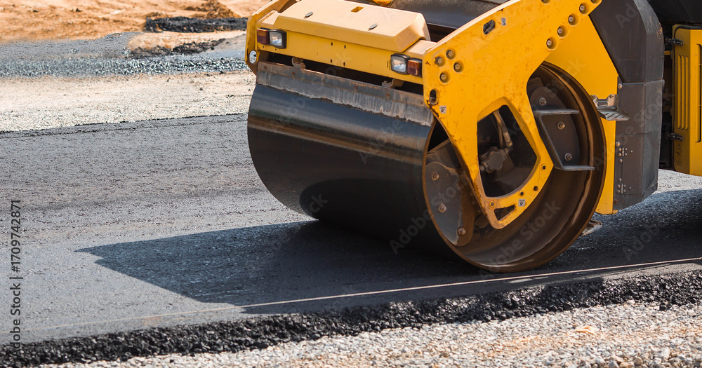 Heavy equipment for earthworks and landscaping. Close-up of a road ...