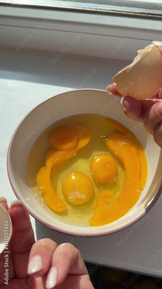 Woman preparing homemade omelette mixing with whisk eggs. Whisking ...