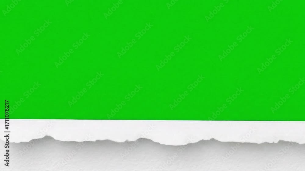 Torn white paper revealing a chroma key green screen a creative ...