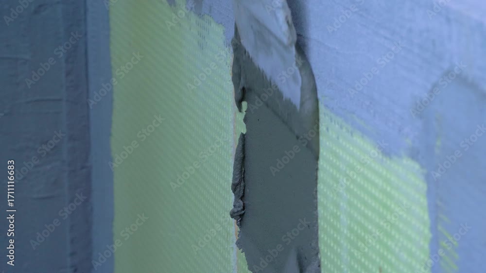 Cladding styrofoam insulation sheets on house facade wall for thermal ...
