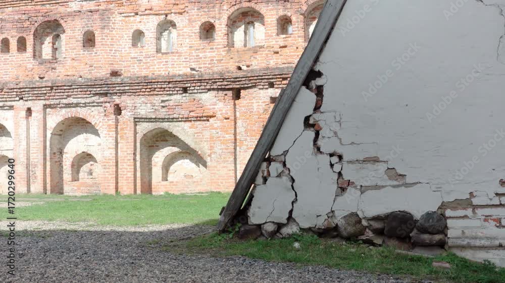 Ancient walls of the Vologda Kremlin (Russia). Narrow loopholes in a ...