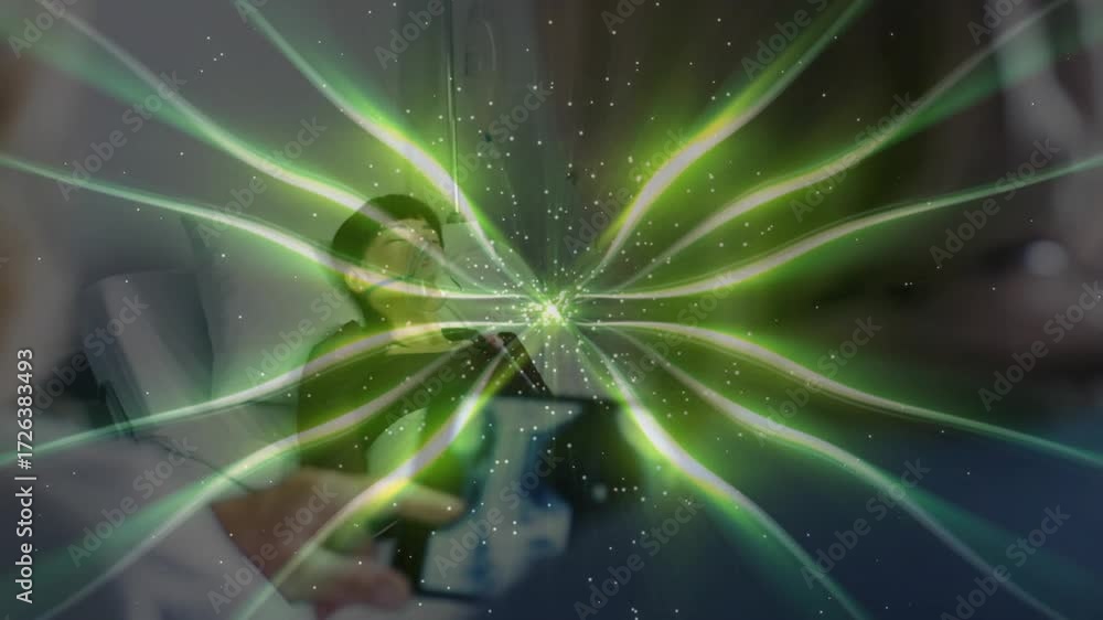 Clinician tapping tablet screen and animating green scan beams while ...