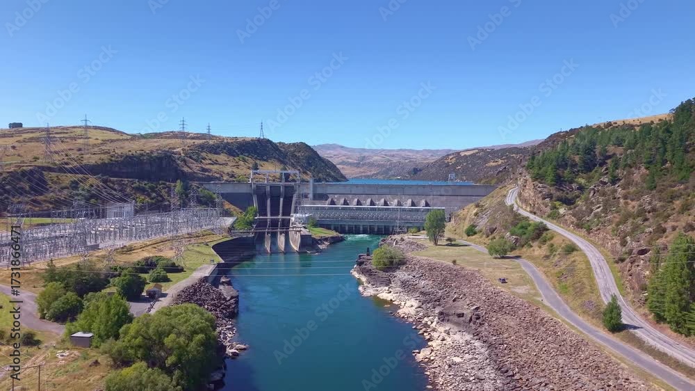 Low reverse aerial rising above the Clutha River to reveal the full ...
