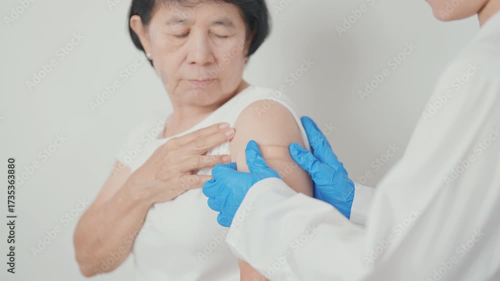 Elderly Woman with bandage after received vaccine. Vaccination and ...